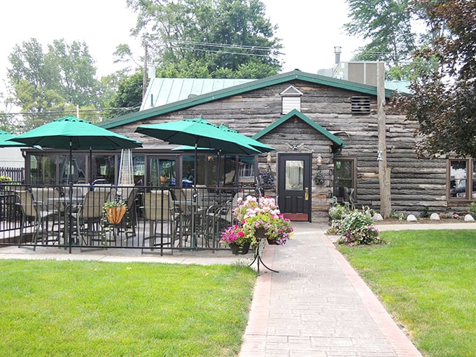 The log cabin exterior of The Whitehouse Inn isn't trying to be rustic chic – it's the real deal, complete with a patio that beckons you to linger.