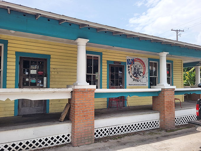 The cheerful yellow exterior of Al's with its turquoise trim isn't just inviting – it's practically a siren song for barbecue lovers wandering through Ybor City.