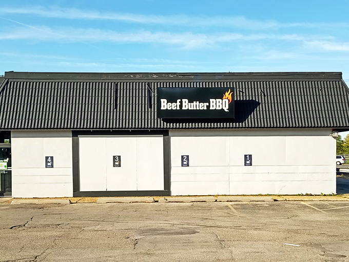 Don't let the modest exterior fool you – this unassuming building houses BBQ treasures that would make a Texan tip their hat in respect.