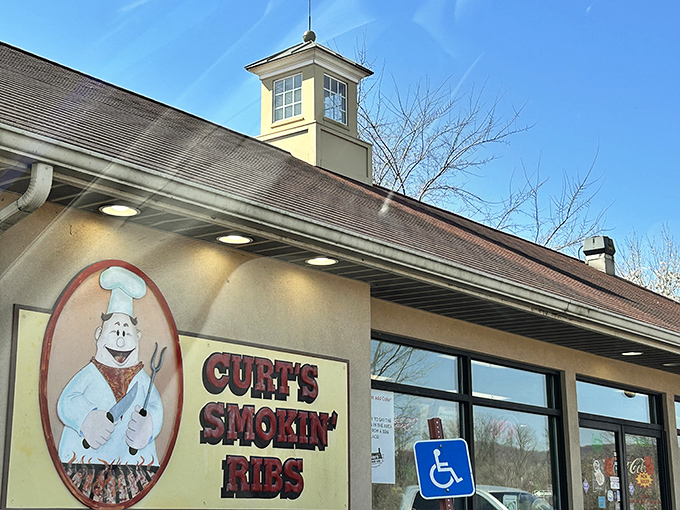 The cartoon pig chef on Curt's façade isn't just cute – he's making a solemn promise about the smoky delights waiting inside.