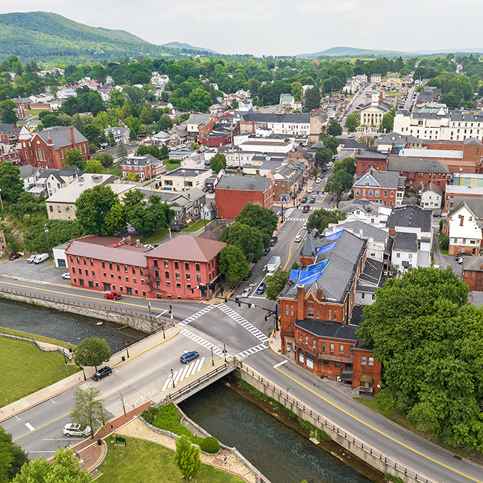 Bellefonte nestles between rolling green hills like a Victorian jewel box someone accidentally left open. The view alone is worth the trip.