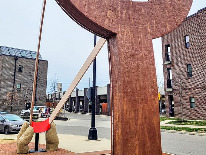 The iconic wooden frame of The Slingshot stands tall against Columbus' urban backdrop, a playful monument to childhood nostalgia supersized for adult appreciation.