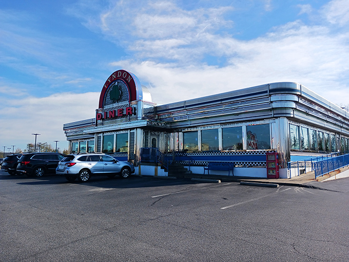 The gleaming chrome exterior of Lyndon Diner shines like a beacon of hope for hungry travelers—a time capsule of Americana serving up comfort on a plate.