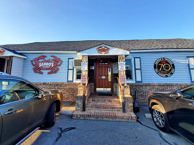 The iconic blue exterior with its bold red crab logo promises seafood treasures within – Delaware's ultimate "come as you are" dining destination.