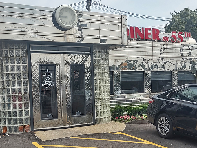 That gleaming stainless steel exterior isn't just a facade—it's a time machine disguised as a diner. Classic glass blocks and neon signage promise authentic nostalgia inside.