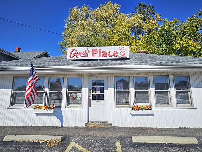 The unassuming white exterior of Gina's Place might fool you, but locals know better—this modest diner houses breakfast magic worth the morning pilgrimage.