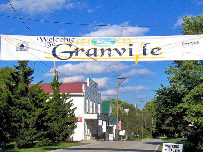 The T.B. Sutton General Store stands as a time capsule with its vintage vehicles parked out front – nostalgia you can actually touch and taste.