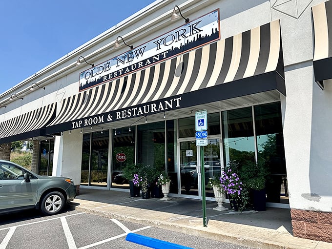 The unassuming storefront with its cheerful hanging flower baskets feels like a secret you've stumbled upon—the best kind of culinary discovery awaits inside.