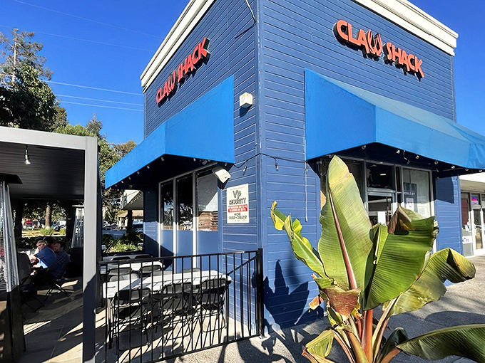 The navy-blue exterior of Claw Shack stands like a beacon of seafood salvation in San Jose. Those red letters promise delicious adventures await inside.