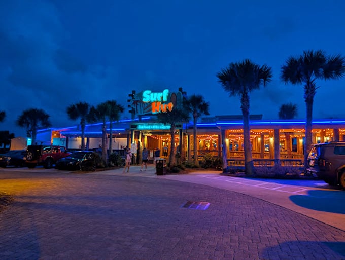 The iconic Surf Hut sign welcomes beach-goers with its vibrant colors and laid-back vibe—like a friendly wave from an old friend.