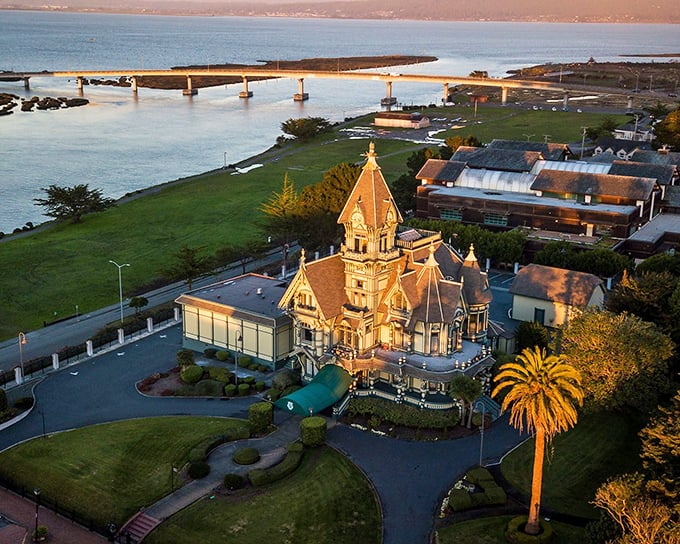 Eureka's Carson Mansion stands like a Victorian confection against the backdrop of Humboldt Bay, where fishing boats bob gently in the harbor's embrace.