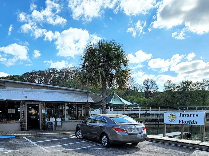 Old Florida charm meets lakeside dining at its finest. The metal roof and green accents of Fish Camp Lake Eustis promise authentic flavors without pretension.