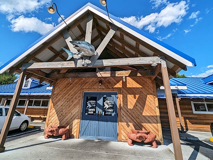 That blue metal roof and wooden siding aren't just coastal charm—they're a beacon calling seafood lovers home to Newport News.