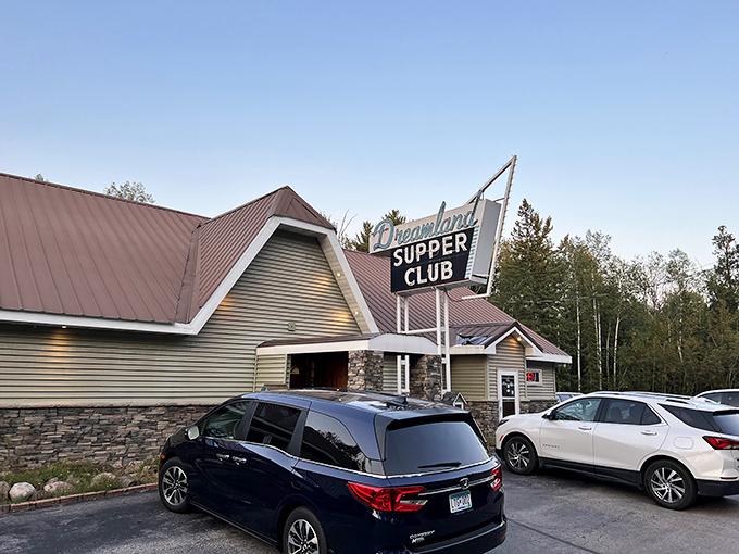 The classic supper club exterior beckons with its vintage sign and stone columns—motorcycles out front always a good sign that locals know something you don't.