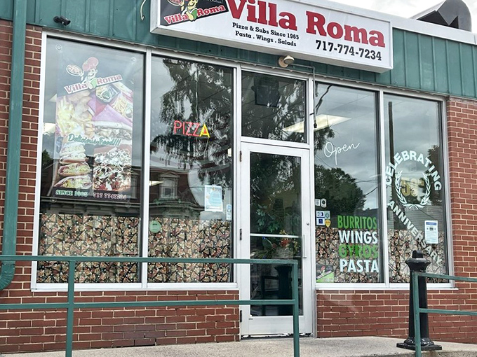 The unassuming storefront of Villa Roma hides culinary treasures within – like finding a Ferrari parked in your neighbor's modest garage.