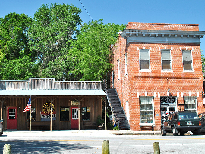 Brick storefronts with palm trees standing guard – Micanopy's main street feels like stepping into a time capsule where Florida's past lives comfortably in the present.