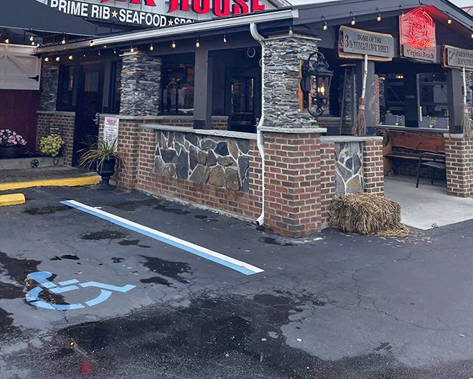 The rustic stone and brick exterior promises old-school charm before you even step inside. That hay bale isn't just for show—it's a preview of the no-nonsense authenticity awaiting within.