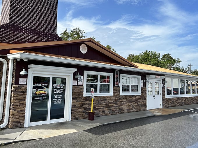 The unassuming exterior of Backyard Boys BBQ hides a smoky paradise within. Like finding a treasure map in your junk drawer—unremarkable until you realize what it leads to.