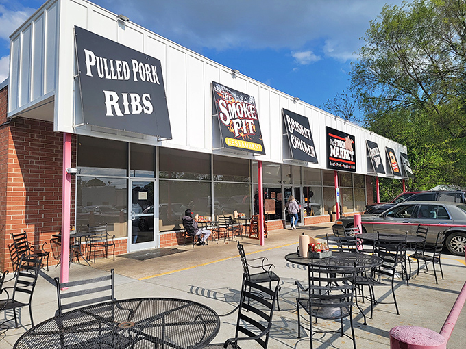 Strip mall exterior that houses barbecue gold – sometimes the best treasures hide in plain sight.
