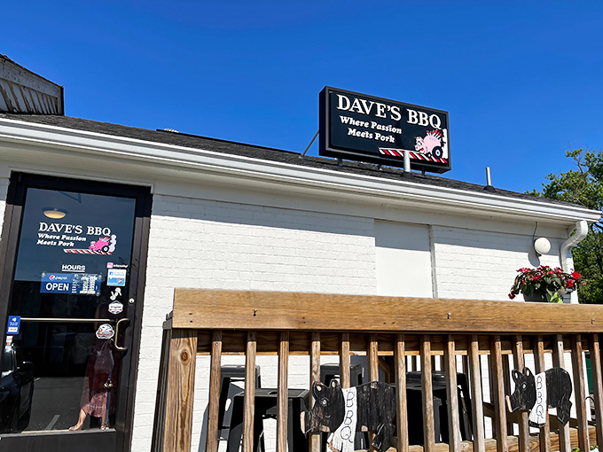 The unassuming white brick exterior of Dave's BBQ hides a smoky paradise within. That sign isn't kidding about passion meeting pork!