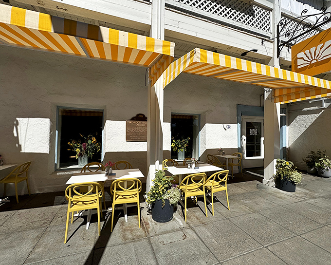 Those cheerful yellow awnings aren't just for show—they're like a beacon calling hungry souls to breakfast paradise in Sonoma Plaza.