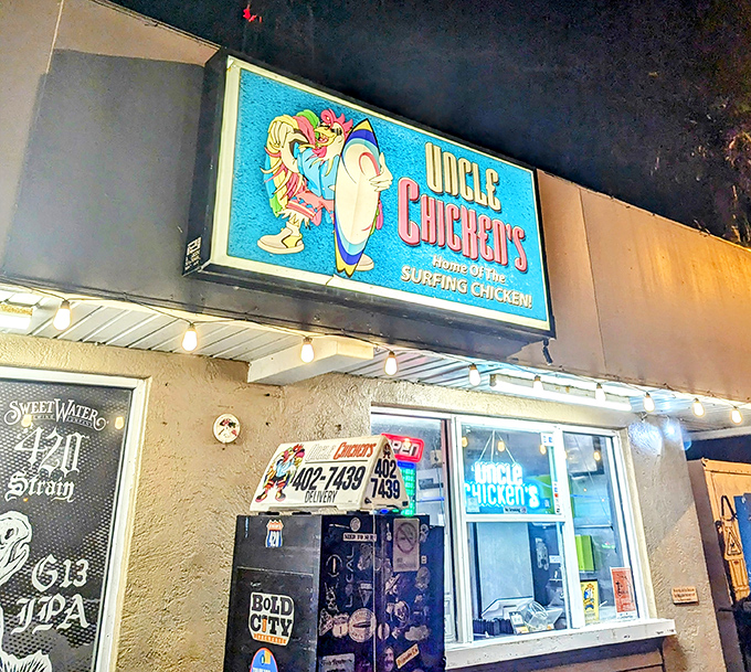 The neon blue glow of Uncle Chicken's at night isn't just a beacon for hungry travelers—it's practically a lighthouse for flavor-seeking souls.