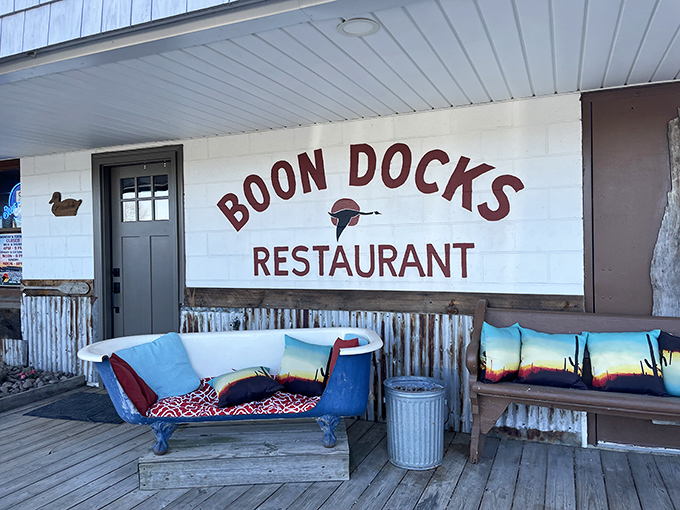 The unassuming facade of Boondocks promises little but delivers culinary treasures. That bathtub sofa? Pure genius – comfort meets coastal quirk.