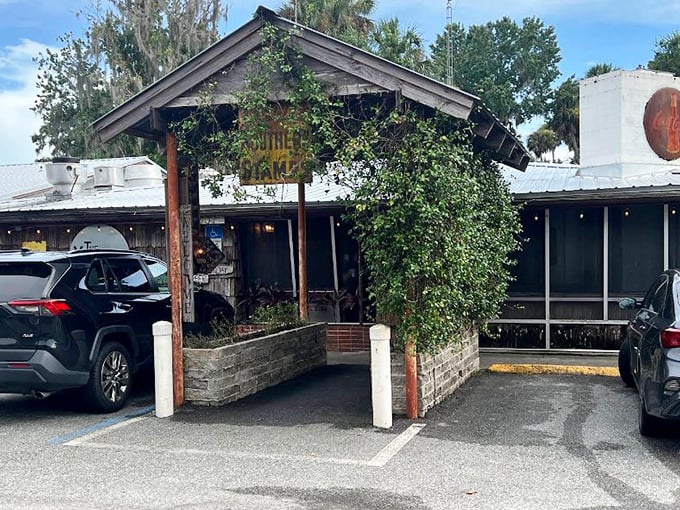 The unassuming entrance to The Yearling Restaurant feels like stepping into a Florida time capsule, where Spanish moss and literary history await hungry travelers.