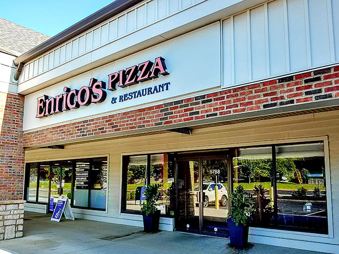 The unassuming storefront that houses pizza greatness. Like finding a Picasso at a yard sale, Enrico's modest exterior belies the culinary treasures within.