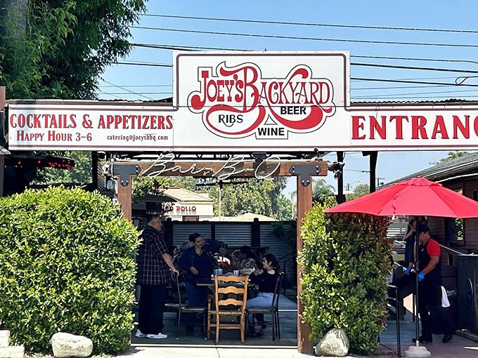 The unassuming terracotta exterior of Joey's BBQ in Chino, where rustic charm hints at the smoky treasures waiting inside.