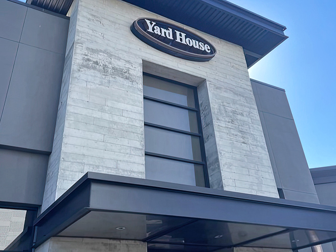 The sleek, modern exterior of Yard House stands like a culinary lighthouse in Fresno, beckoning hungry travelers with promises of craft beer and elevated comfort food.