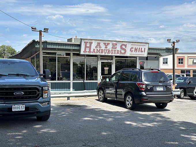 The unassuming exterior of Hayes Hamburgers & Chili stands like a time capsule on Truman Road, promising honest food without the Instagram filters.