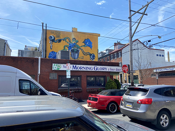 The sunshine-yellow mural above Morning Glory Diner isn't just decoration—it's a beacon calling breakfast lovers home to this South Philly institution.