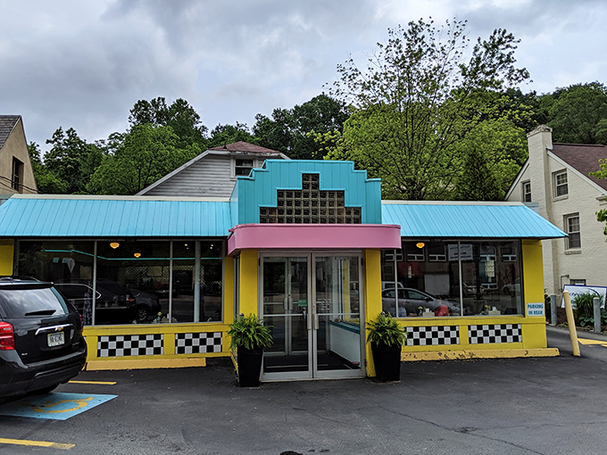 The turquoise and yellow exterior of Valliant's Diner stands out like a Technicolor dream in Pittsburgh's landscape, beckoning hungry travelers with retro charm.
