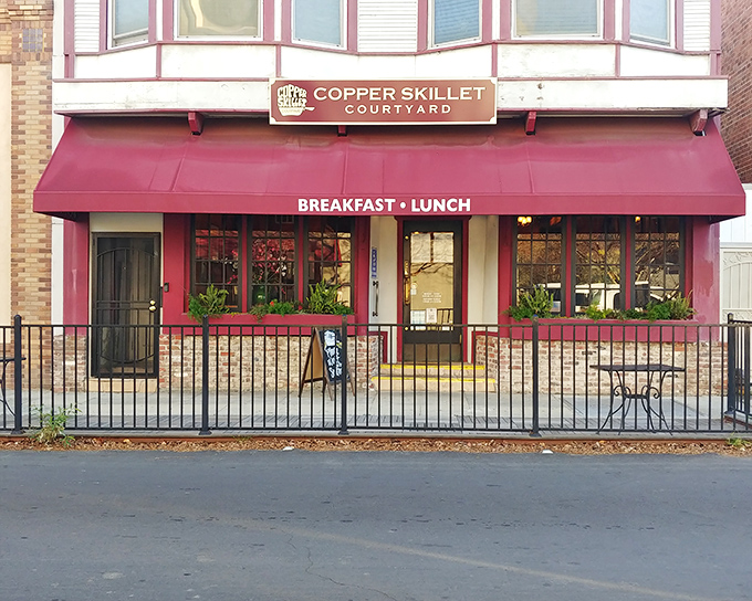 The crimson awning beckons like a breakfast lighthouse in downtown Martinez, promising comfort food salvation for hungry souls wandering Main Street.