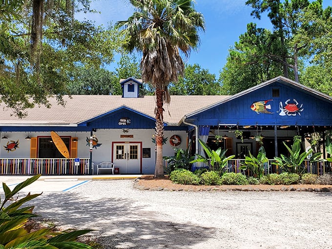 The blue coastal charm hits you before you even walk in—tropical plants, string lights, and decorative crabs promising seafood paradise awaits.