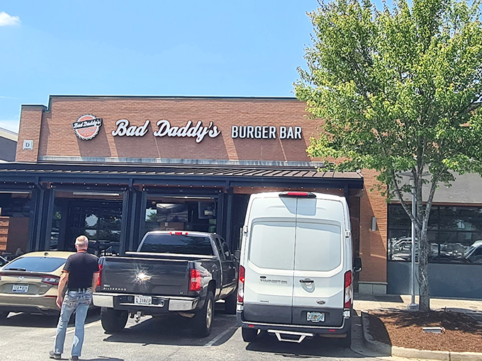 The brick facade of Bad Daddy's beckons hungry travelers like a burger lighthouse on Woodruff Road's sea of retail options.