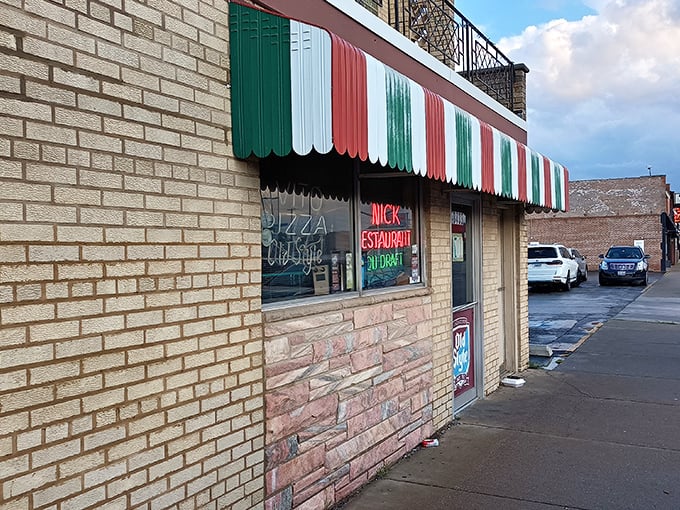 The Italian flag-inspired awning isn't just decoration—it's a beacon of pizza promise on Chicago's South Side since 1932.