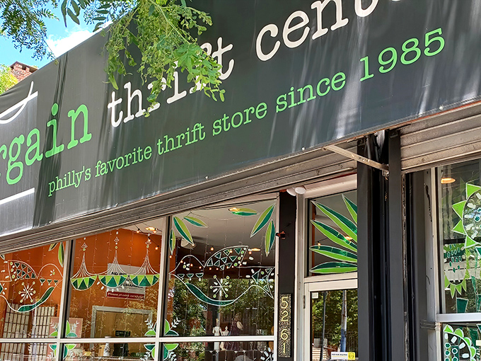 The sleek black storefront with bright green lettering promises treasures within—Philadelphia's favorite hunting ground for the thrifty and the curious.