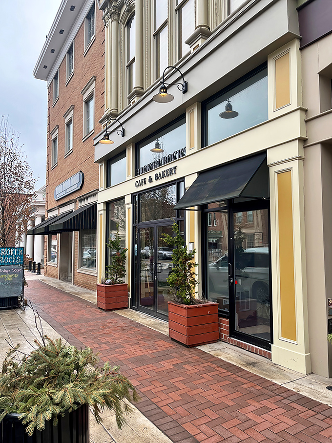 The charming brick façade of Broken Rocks beckons from downtown Wooster, promising culinary delights behind those elegant black awnings.