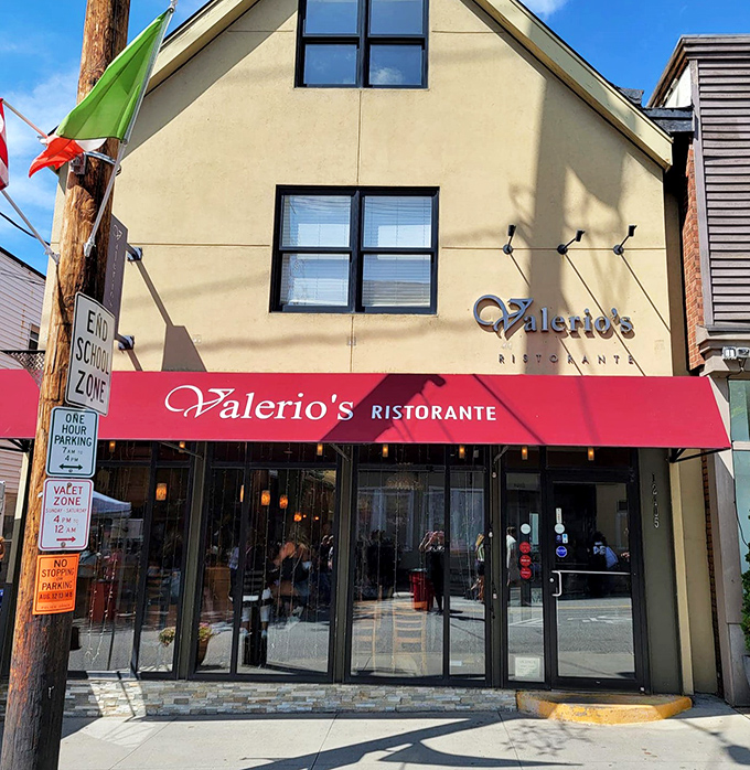 The burgundy awning and warm glow of Valerio's at night—like a beacon calling all pasta pilgrims home to roost.
