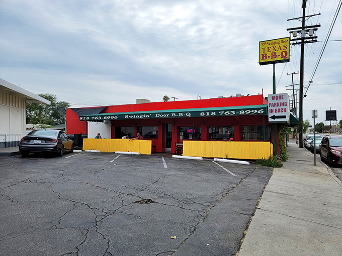 The bright red exterior with yellow accents isn't trying to be fancy—it's saving all that energy for what matters: the meat inside.
