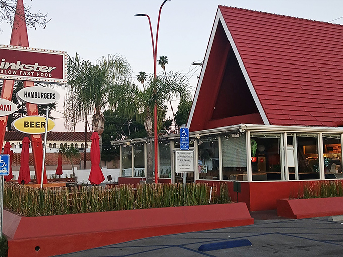 The iconic A-frame roof of The Oinkster stands as a beacon of culinary delight in Eagle Rock, promising retro charm and modern flavors.