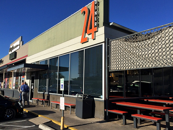 The iconic "24" sign beckons hungry souls like a lighthouse for comfort food cravings, promising salvation at any hour.