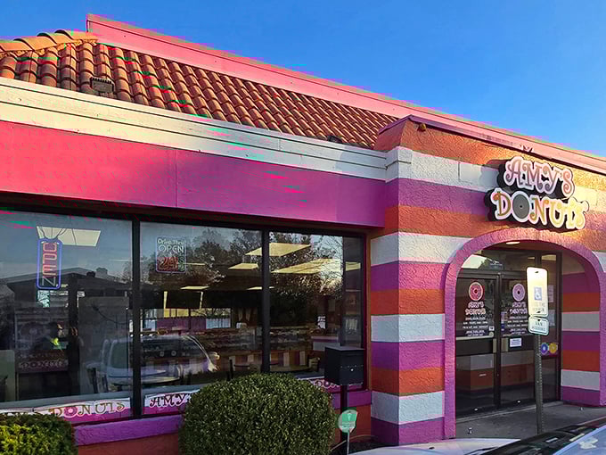 The candy-striped exterior of Amy's Donuts looks like Willy Wonka designed a building. Even from the street, it promises sugary adventures await inside.