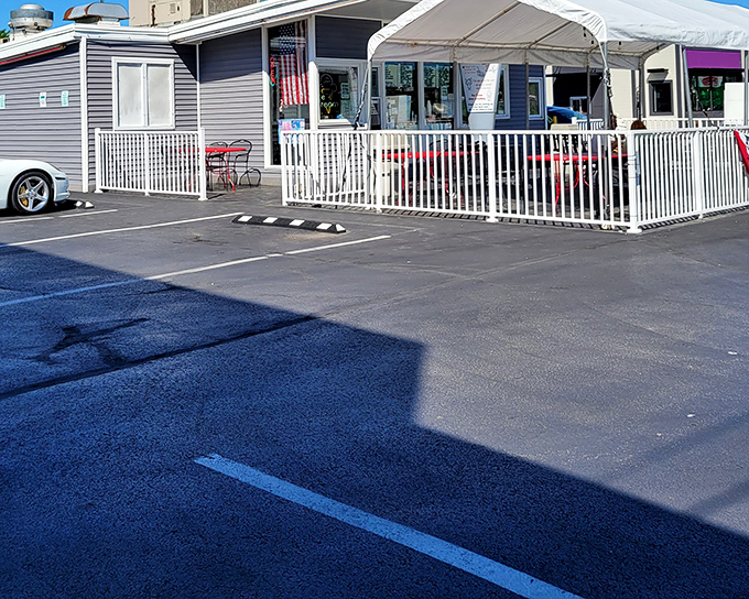 The white picket fence isn't just for show—it's containing pure happiness in the form of ice cream and comfort food at Miller's Drive-In.