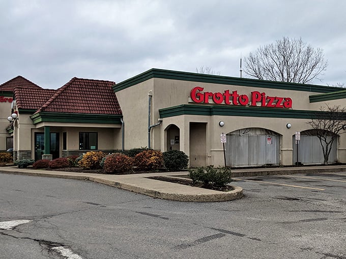 The humble exterior of Grotto Pizza belies the culinary treasures within. That red sign has been guiding hungry Pennsylvanians to pizza paradise since 1953.