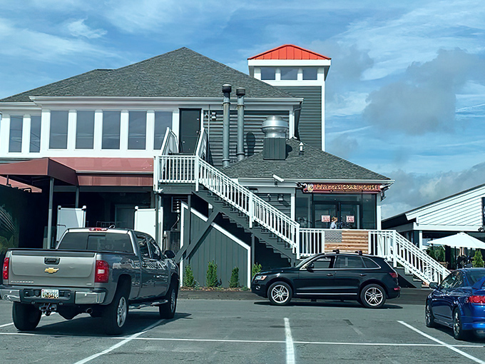 The weathered gray exterior of Harris Crab House stands like a sentry guarding Maryland's seafood secrets. No pretension here—just the promise of Chesapeake Bay perfection.