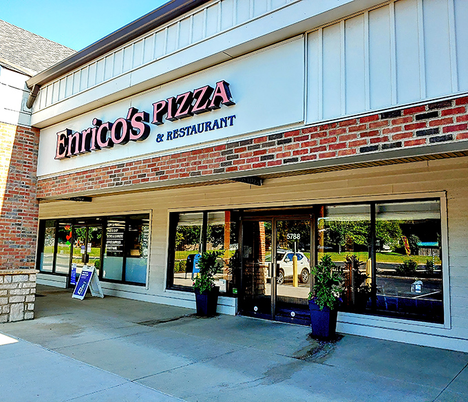 Strip mall treasures like Enrico's prove the old adage: never judge a pizza by its plaza. The unassuming exterior hides culinary magic within.
