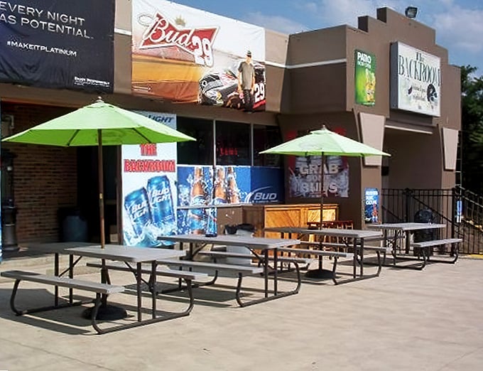 The exterior promises good times with those cheerful umbrellas – like a backyard BBQ that got its own building.